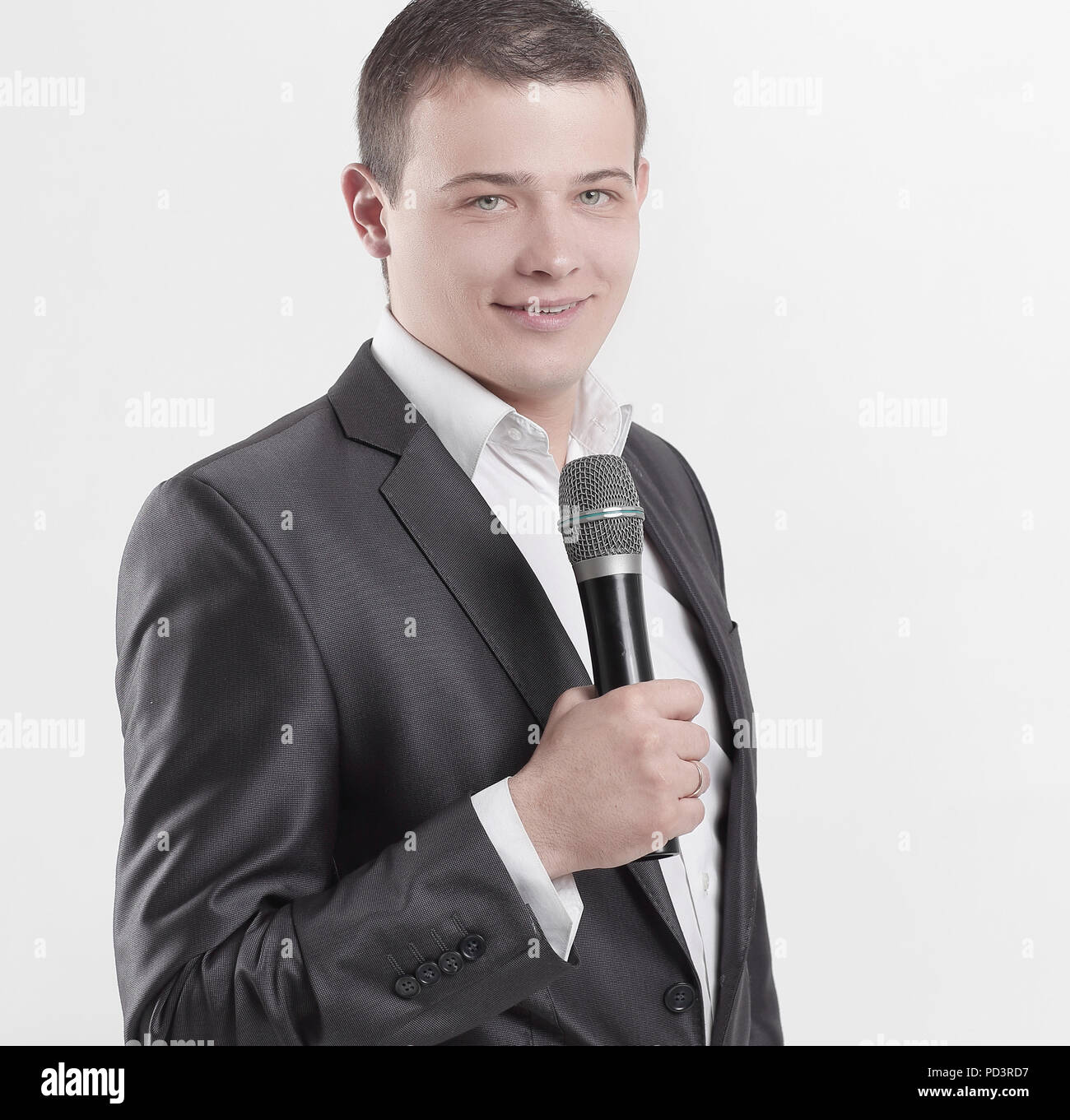 young speaker with a microphone.isolated on white background Stock ...