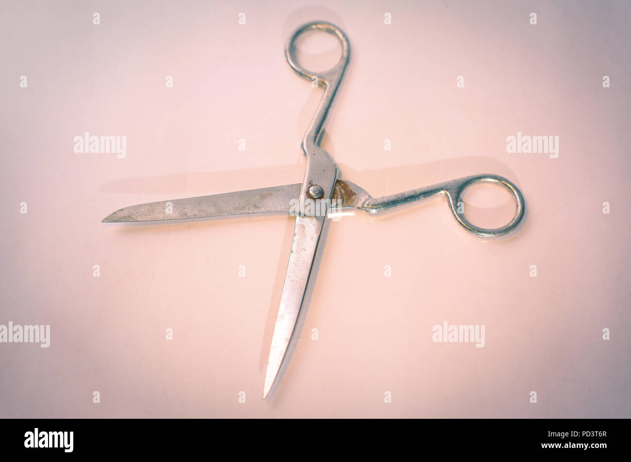 old scissors.isolated on a dark background Stock Photo - Alamy