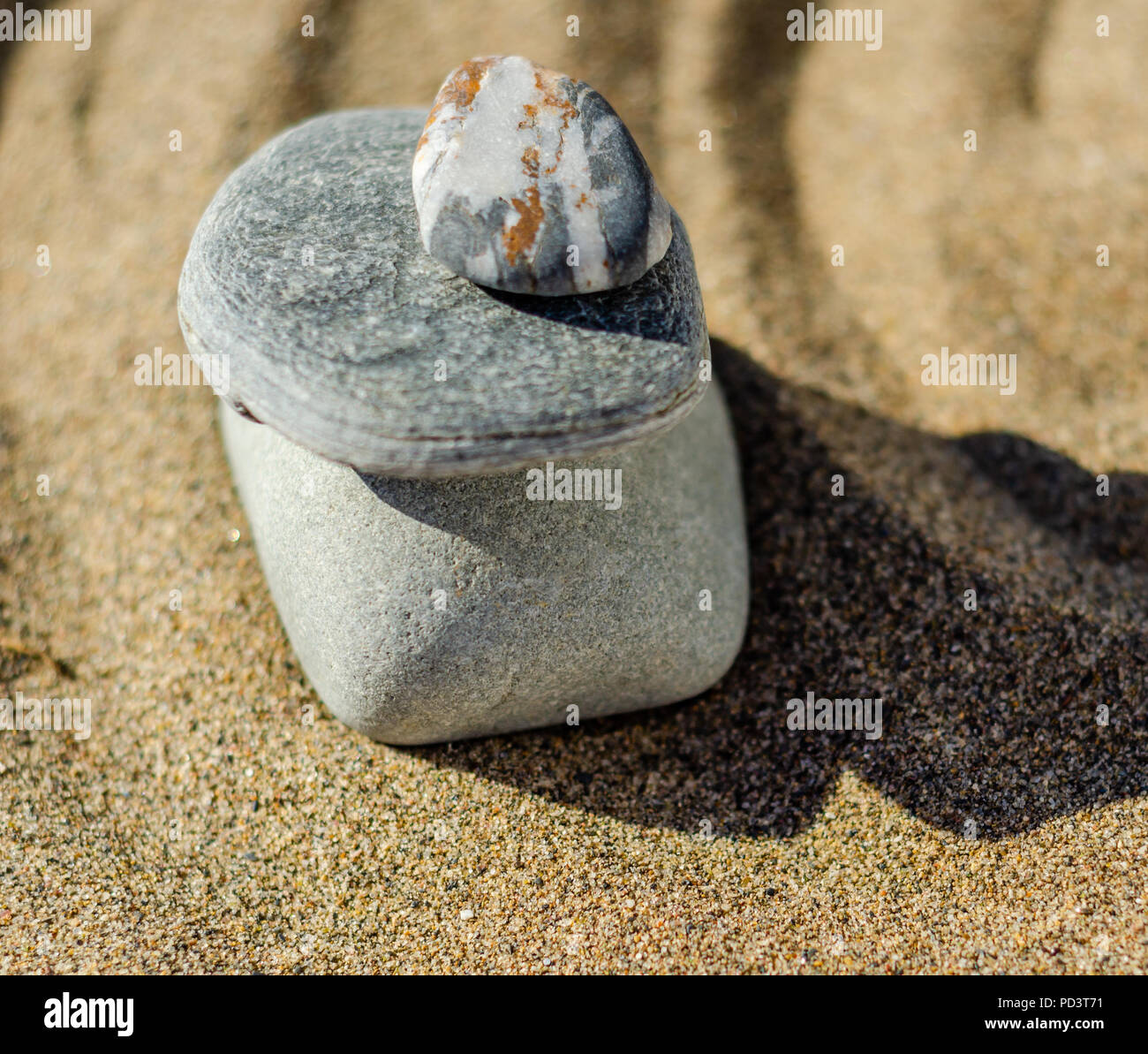 zen meditation stone in sand, concept for purity harmony and ...