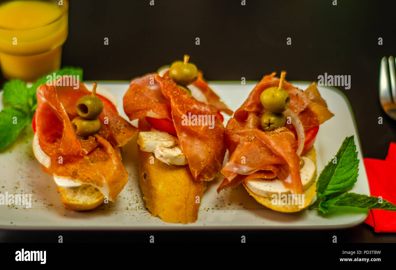 traditional spanish tapas for lunch table, mini sandwiches food set ...