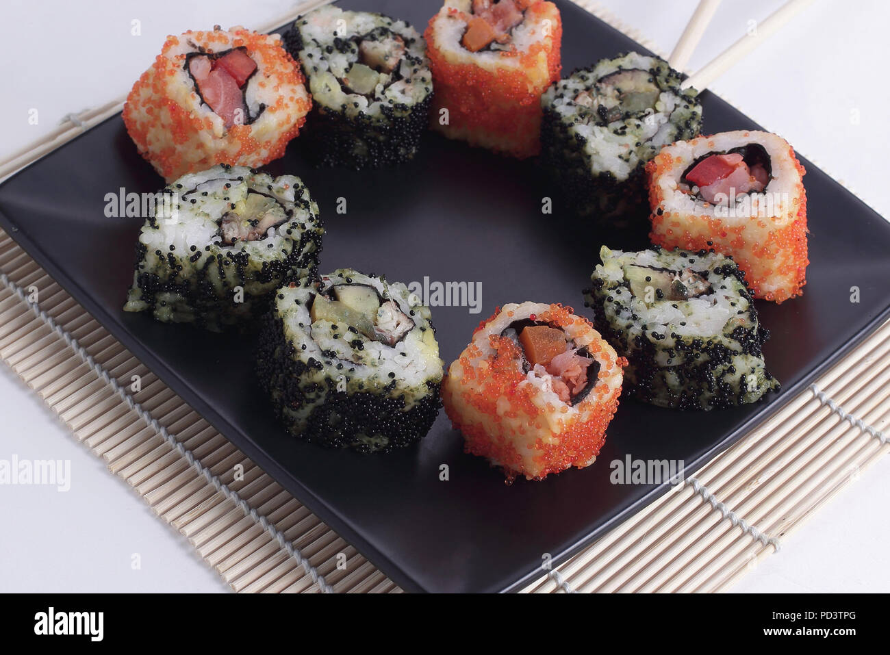 Sushi Set - different types of Maki sushi and chopsticks on a b Stock ...