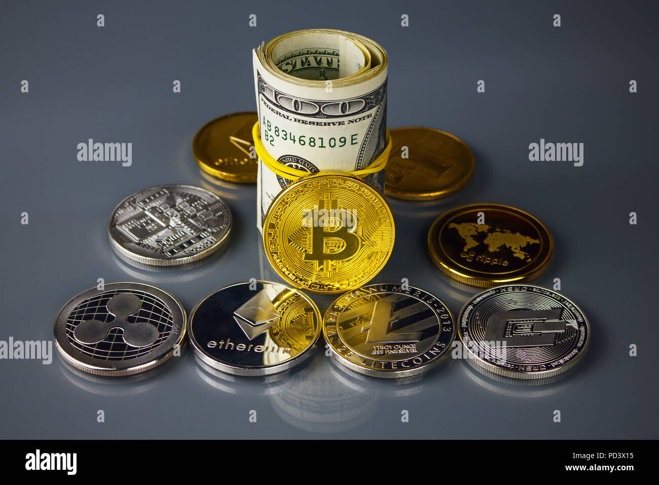 Coins of different crypto-currencies with dollars Stock Photo - Alamy