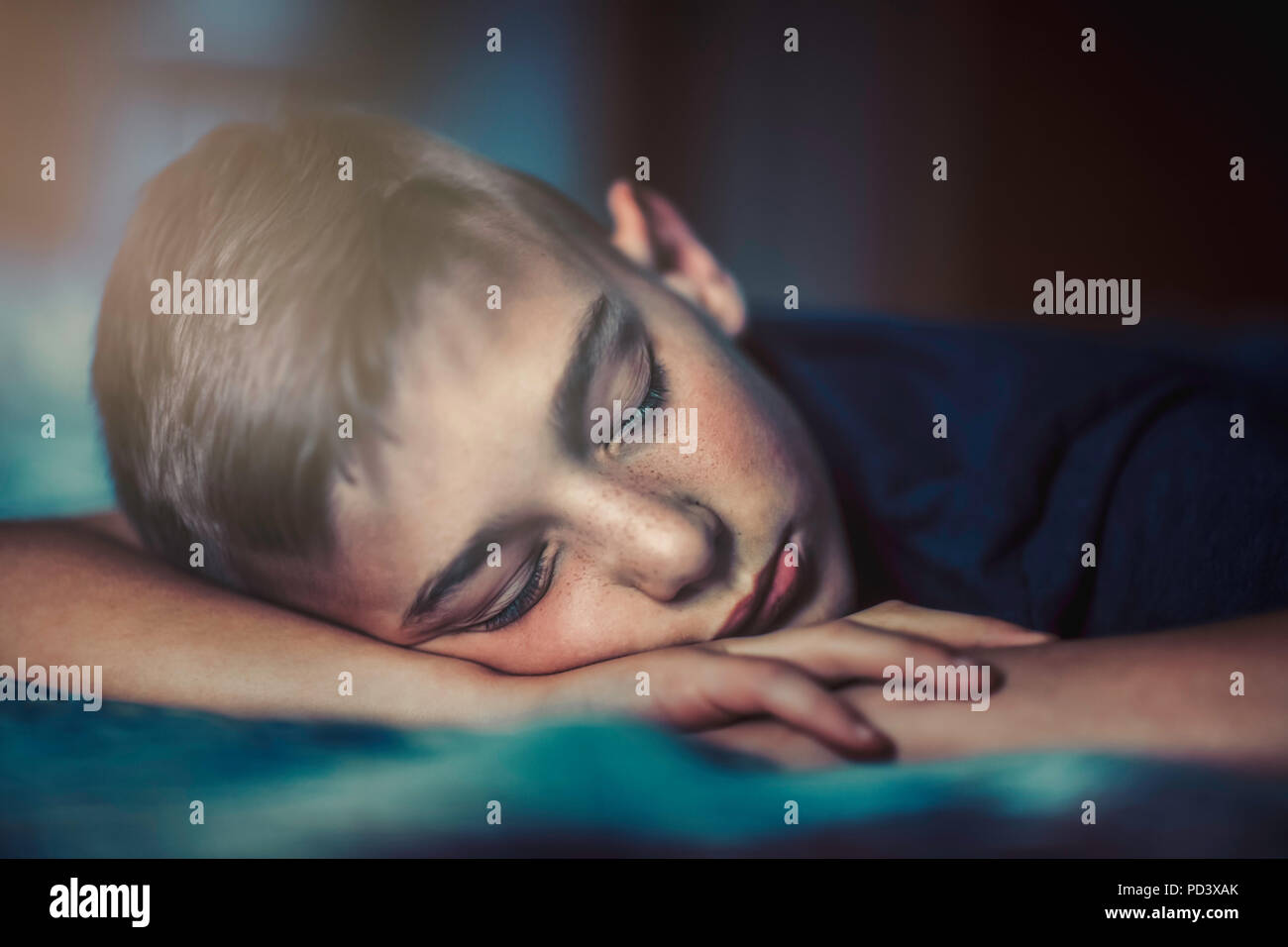 Boy sleeping on front Stock Photo - Alamy