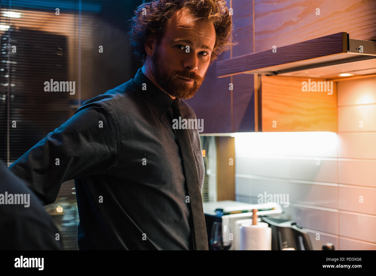 Man standing in kitchen Stock Photo - Alamy
