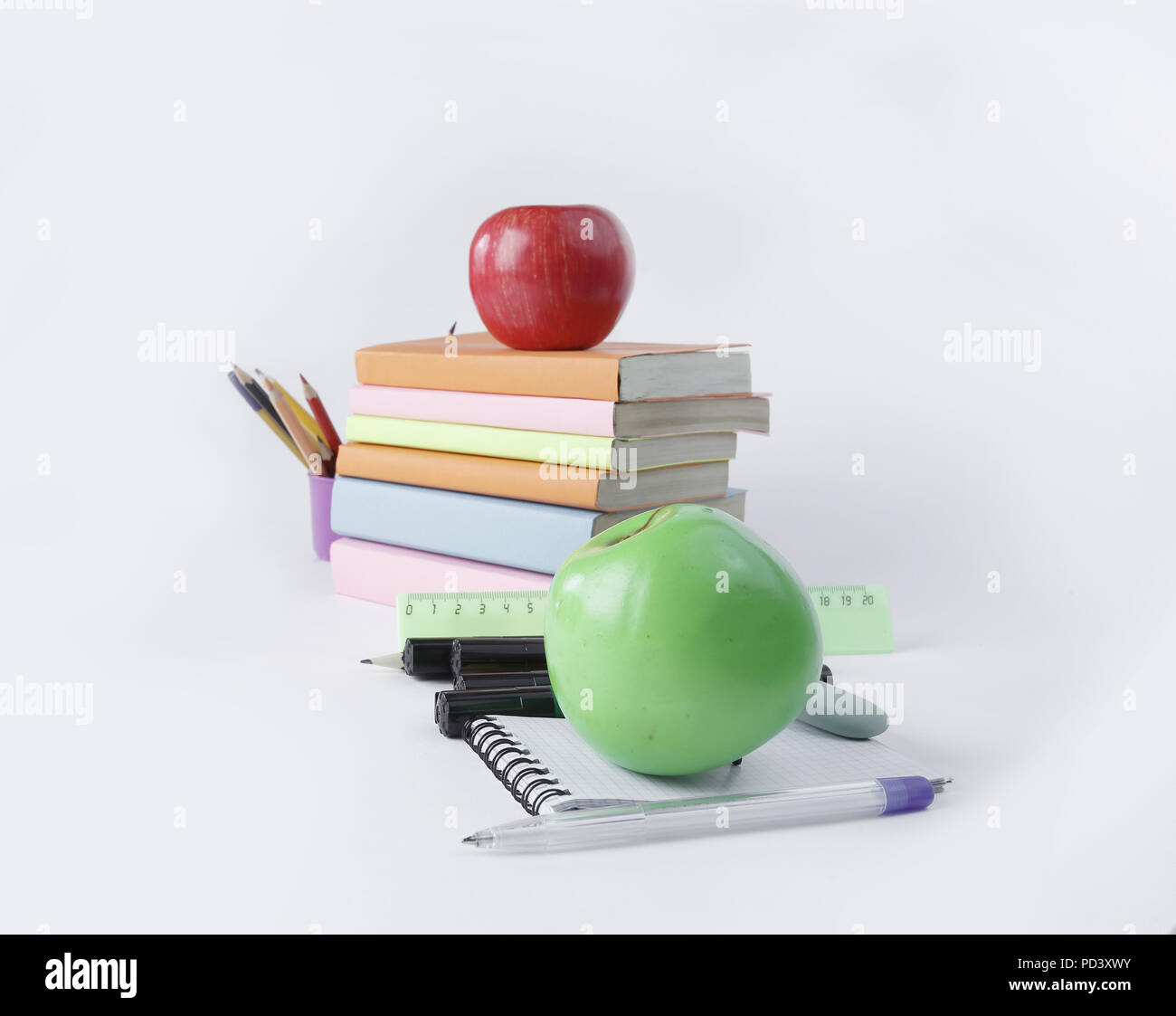 two apples and and school supplies on white background .photo with copy ...