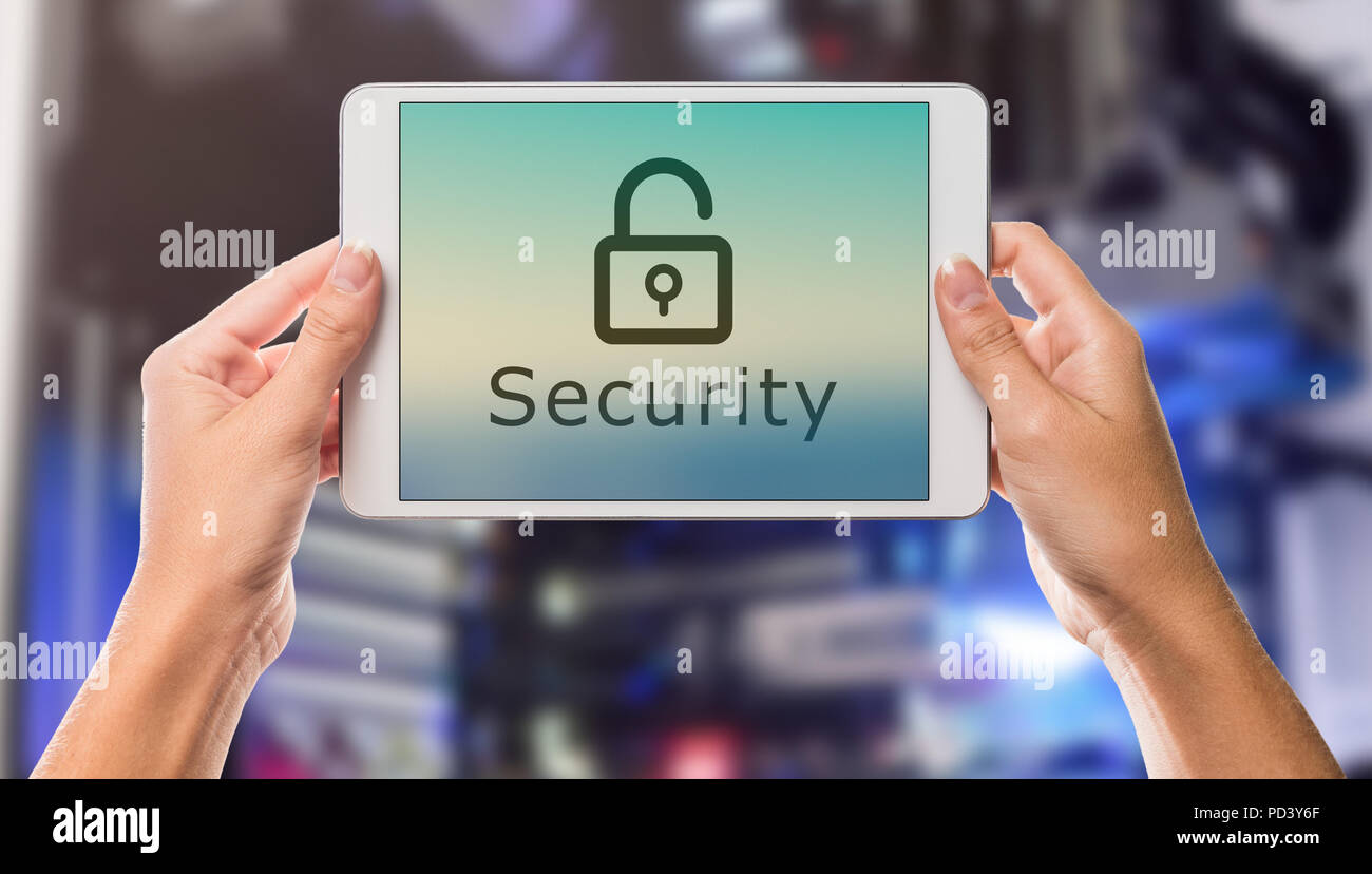 Security written on tablet screen with hands holding the device up with ...