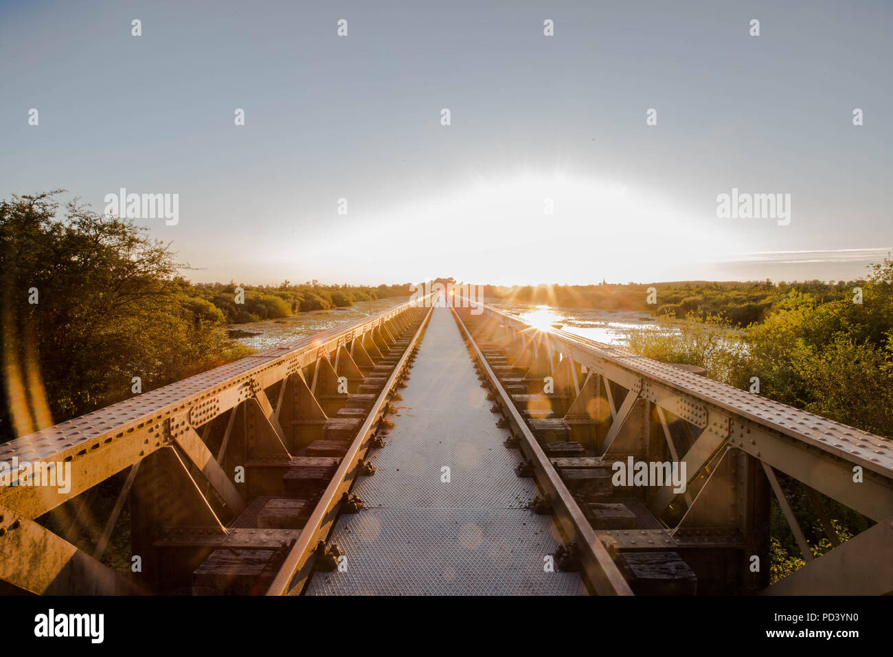 Old steel railway bridge on the river with beautiful sunset Stock Photo ...