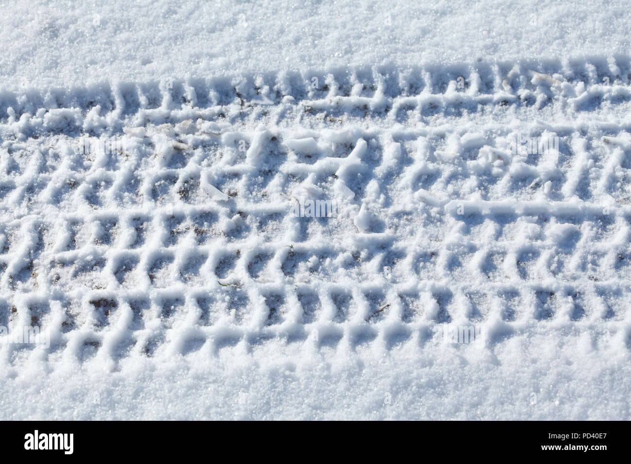 Tire track in the snow, background picture, texture Stock Photo - Alamy