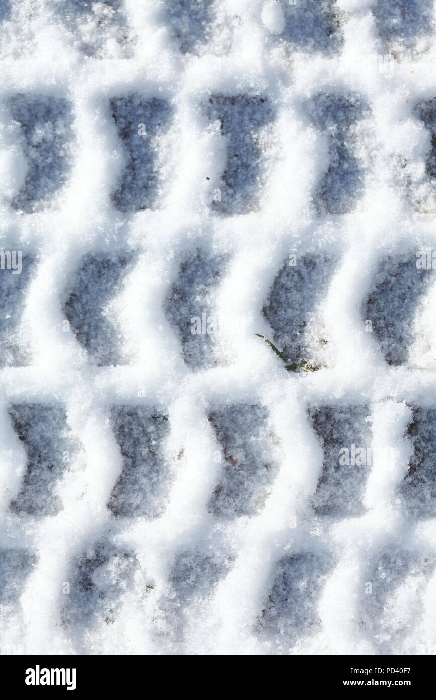 Tire track in the snow, background picture, texture Stock Photo - Alamy