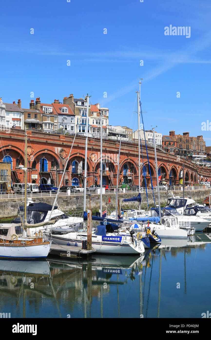 The harbour in front of the Victorian arches, in the coastal town of ...