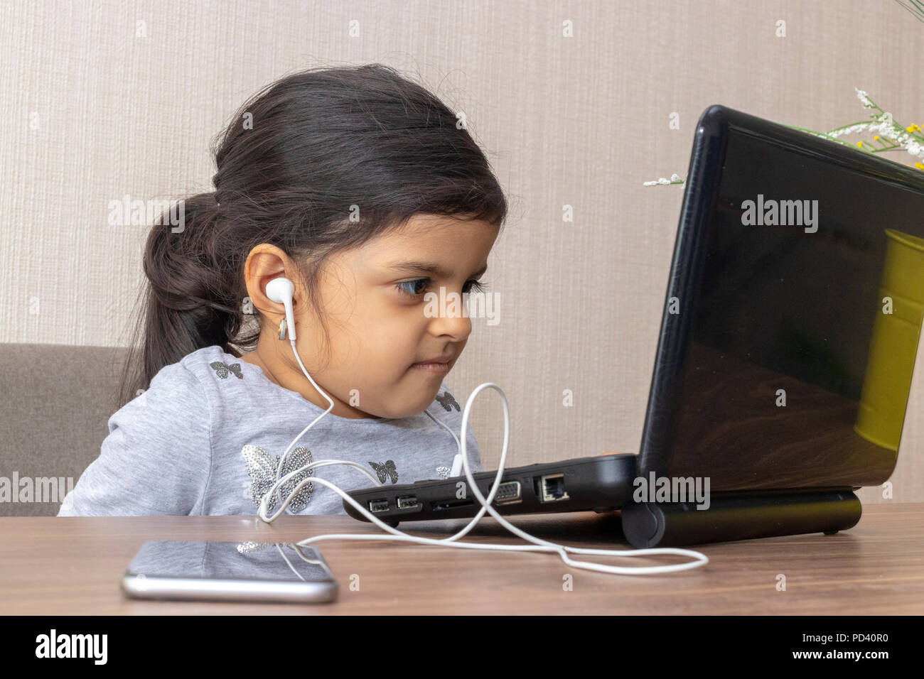 Cute little girl working in the office Stock Photo - Alamy