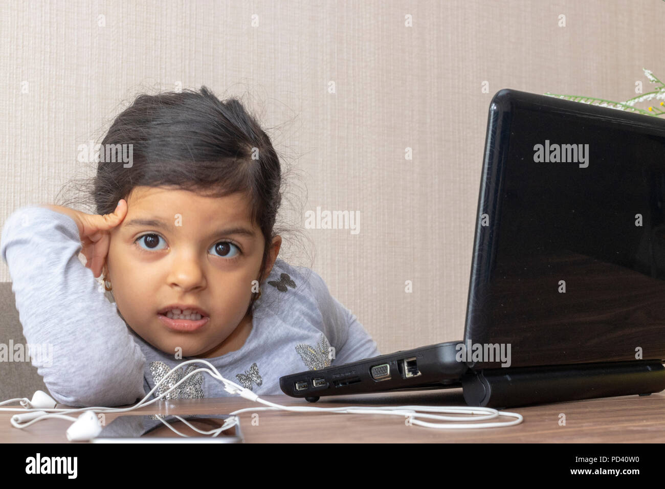 Cute little girl working in the office Stock Photo - Alamy