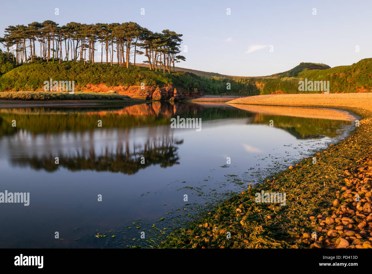 Sunset at the Otter Estuary, part of the Jurassic Coast UNESCO site, in ...