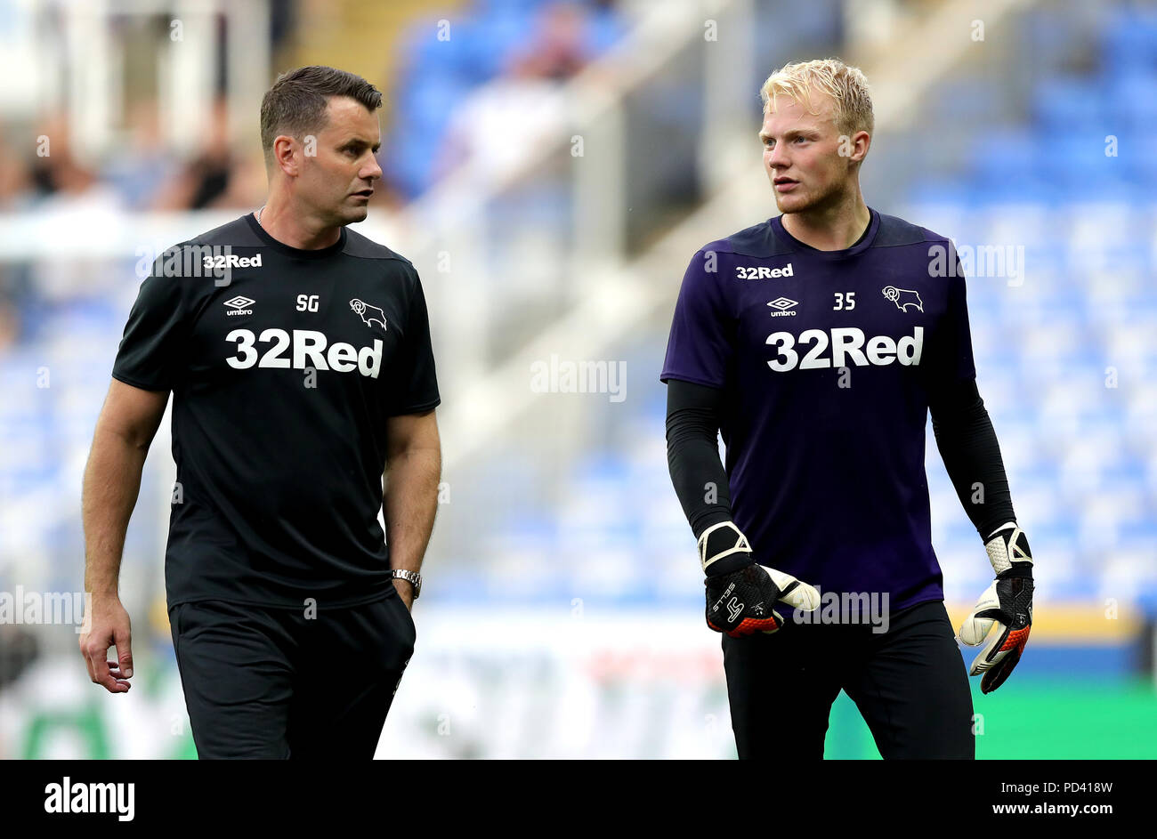 Derby County goalkeeper Jonathan Mitchell (right) and goalkeeper coach ...