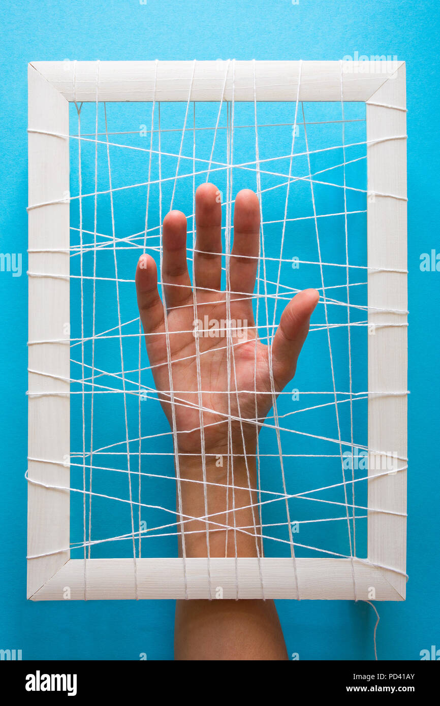 Mental health concept. Women's hands try to break the fetters on blue ...