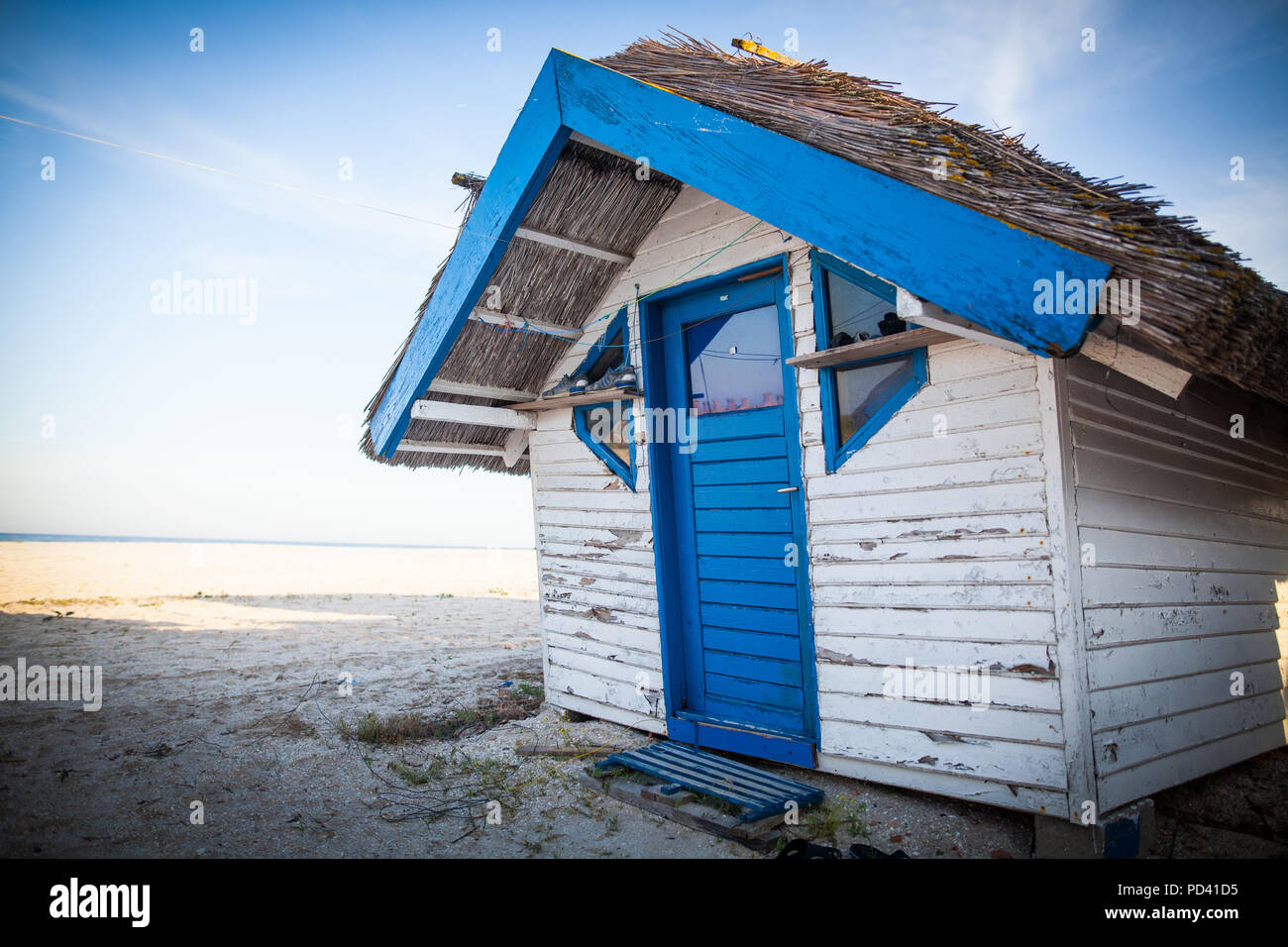 Blue and white painted hut in a sea resort Stock Photo - Alamy