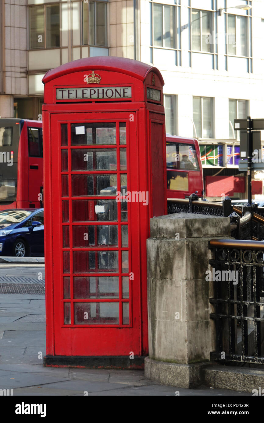 Traditional red British telephone booth on a London Street corner Stock ...