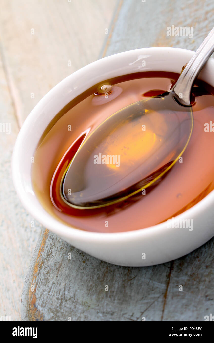 refined golden sugar syrup in dish Stock Photo - Alamy