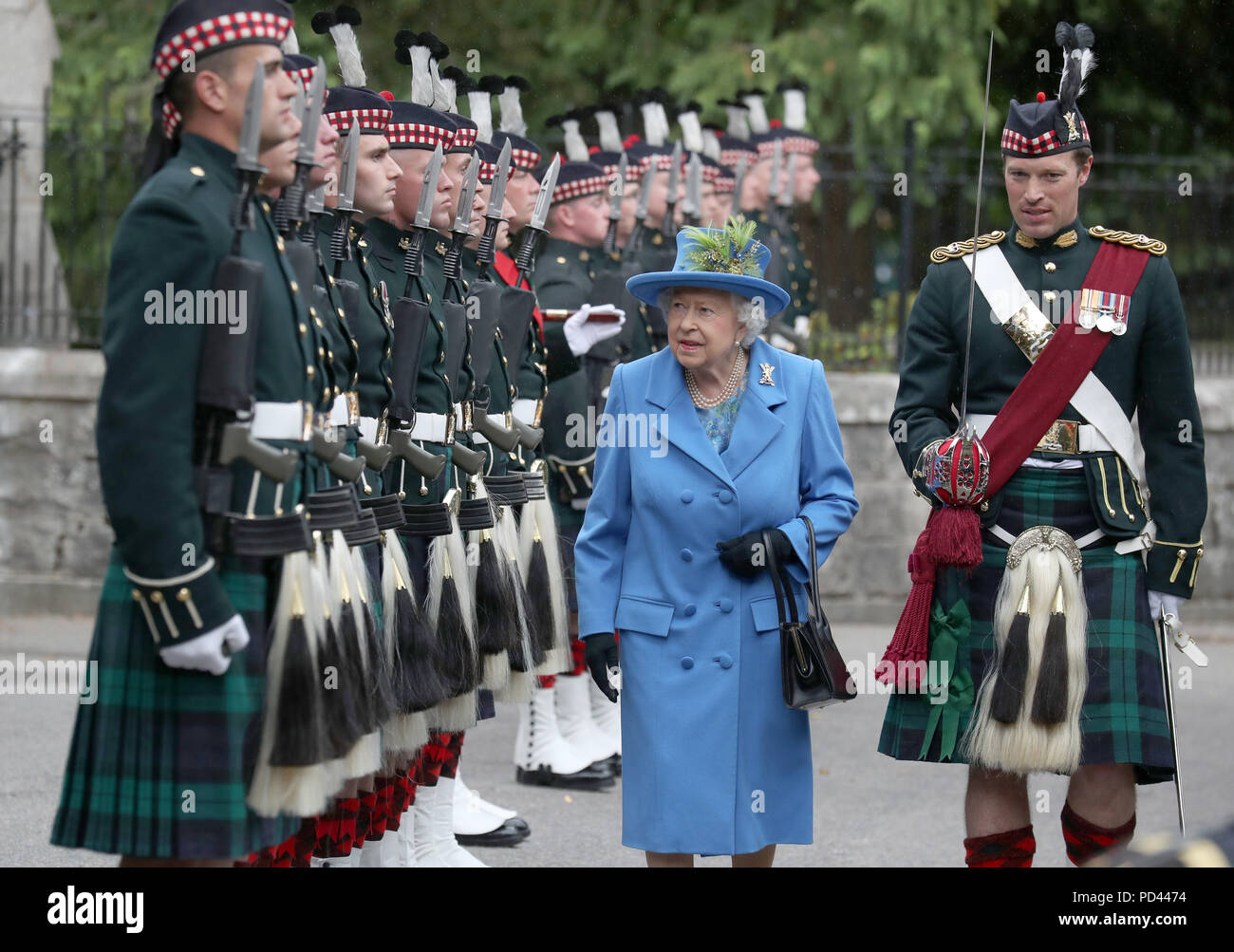 Queen Elizabeth II, with Officer Commanding Major Johnny Thompson ...
