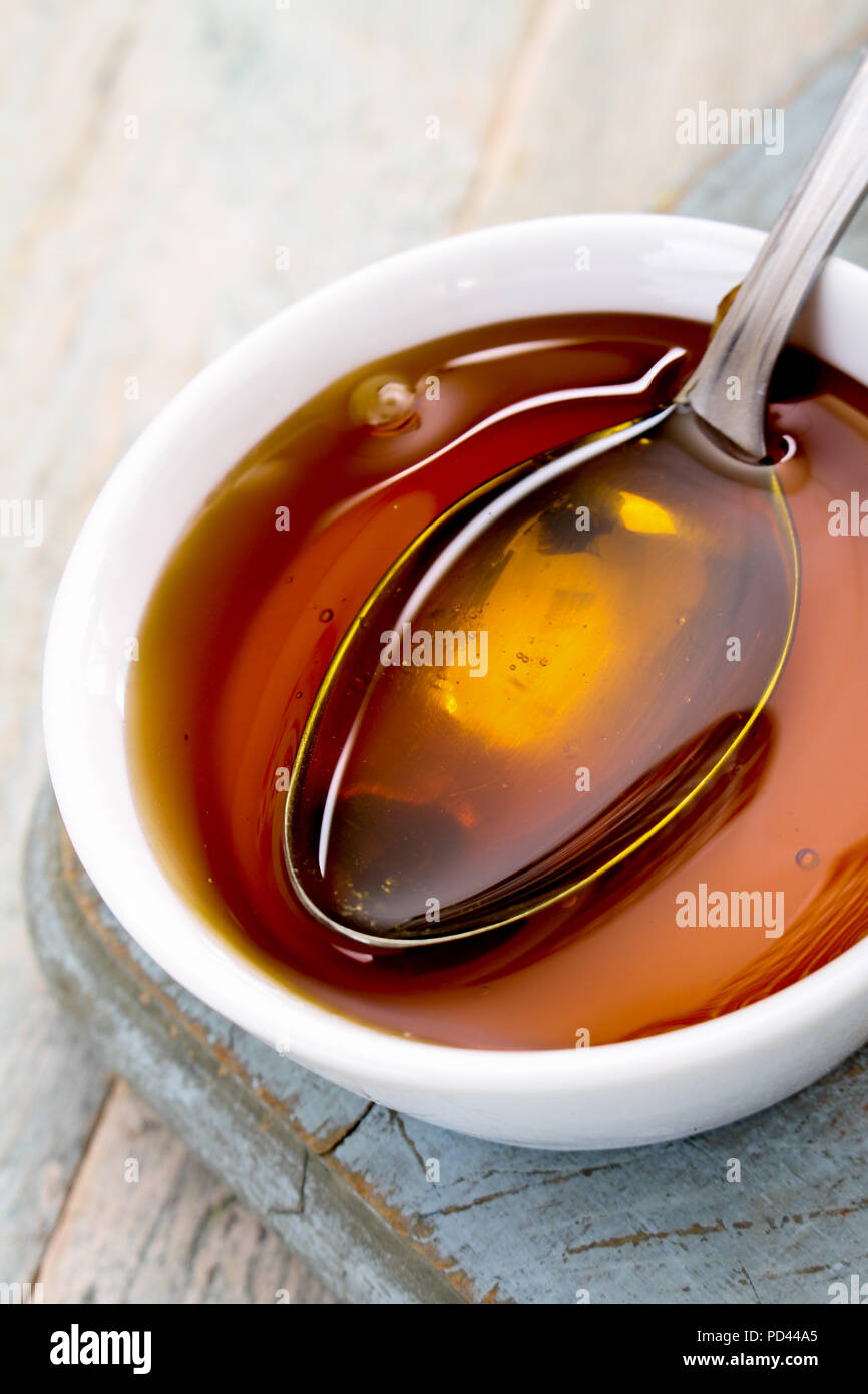 refined golden sugar syrup in dish Stock Photo - Alamy