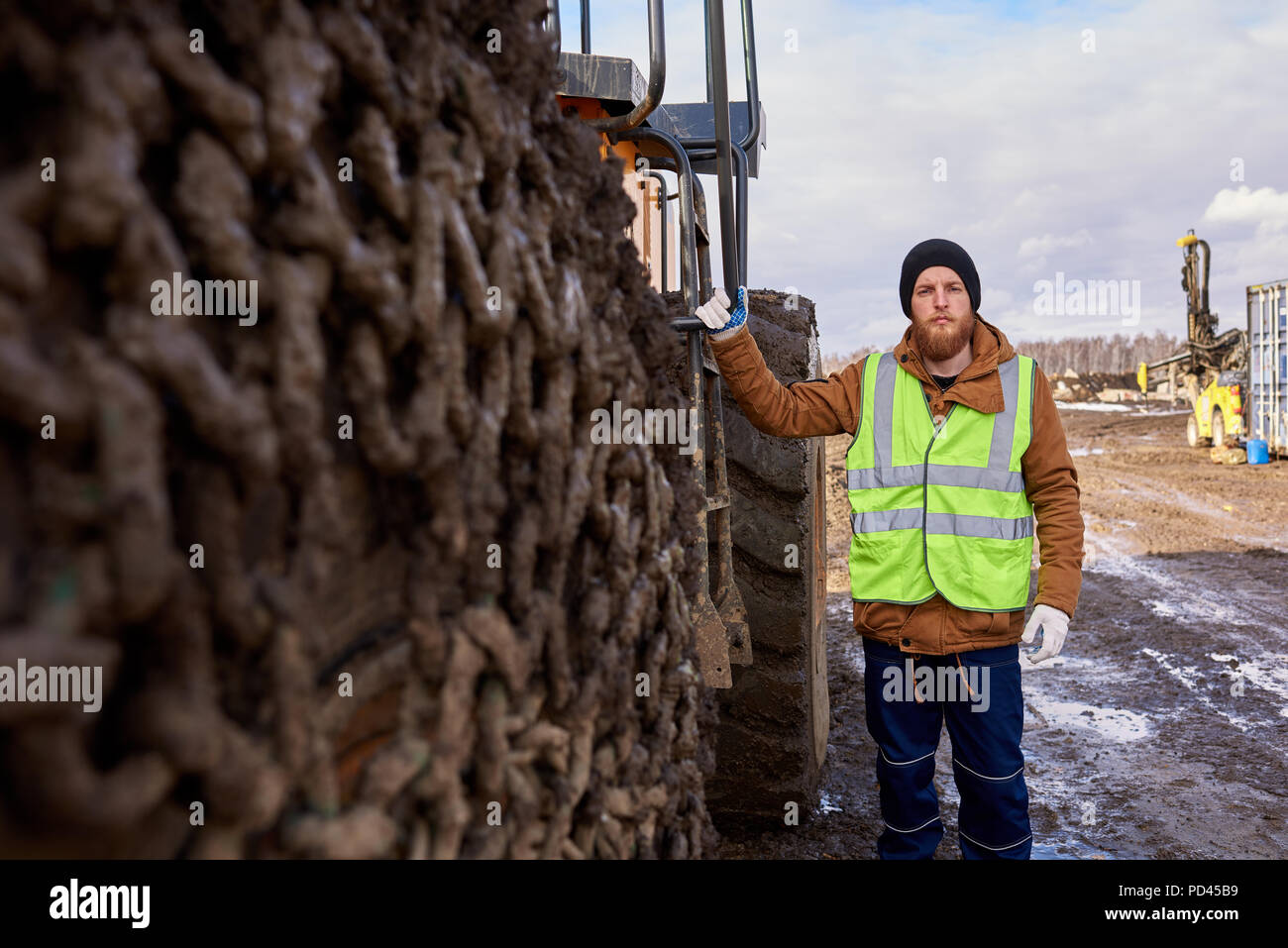 Bearded Worker Posing with Heavy Truck Stock Photo - Alamy