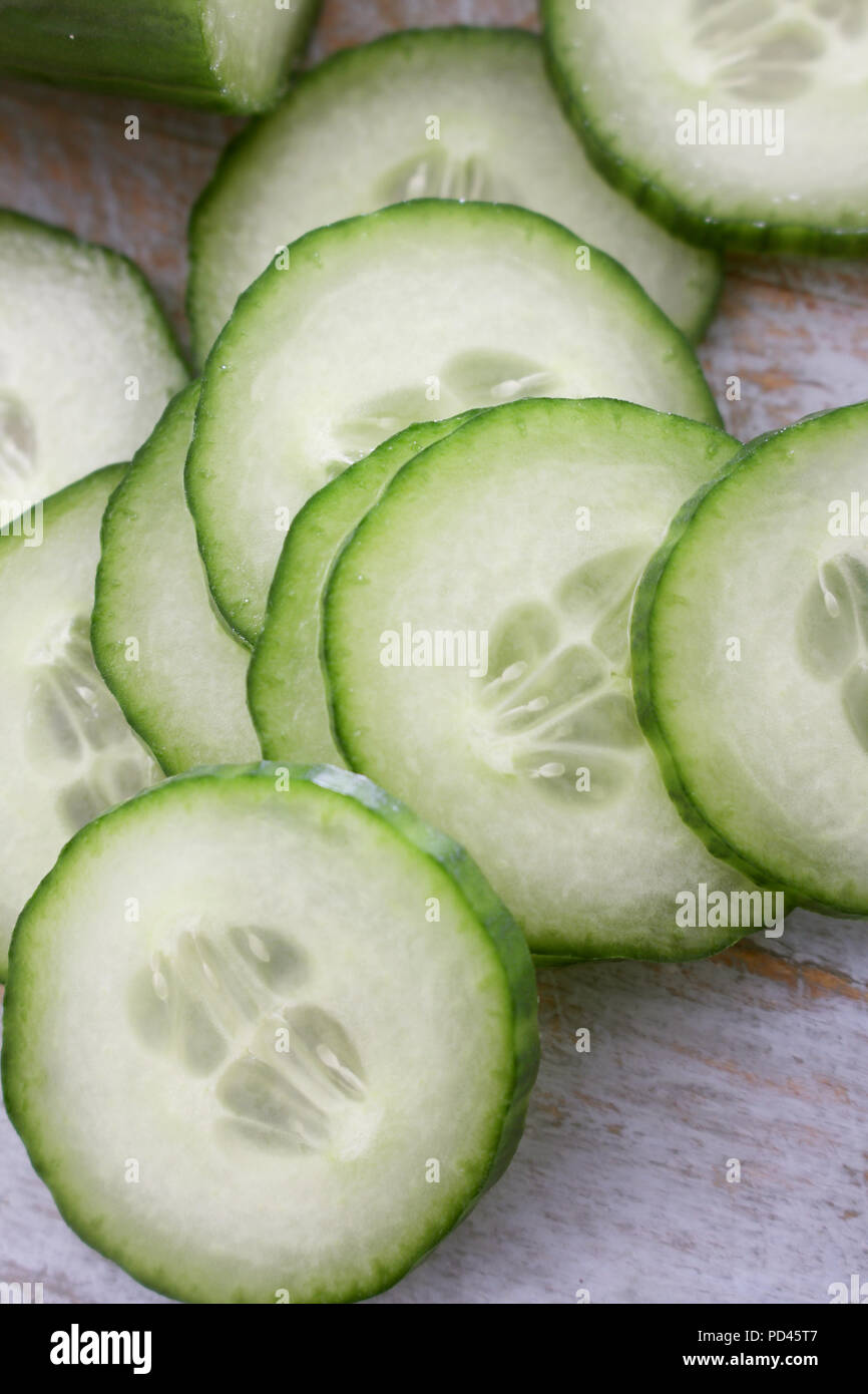 slicing fresh cucumber Stock Photo - Alamy