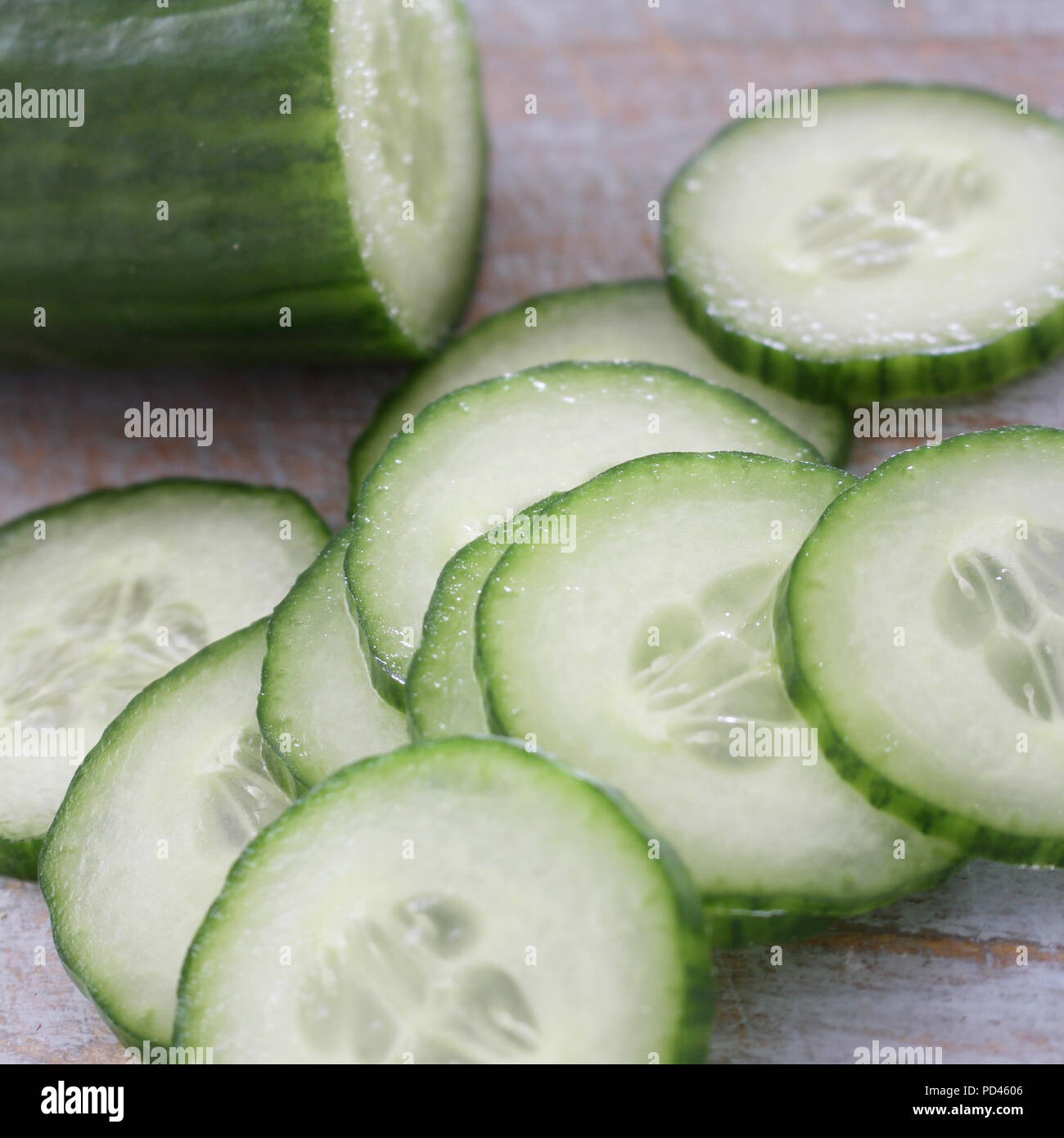slicing fresh cucumber Stock Photo - Alamy