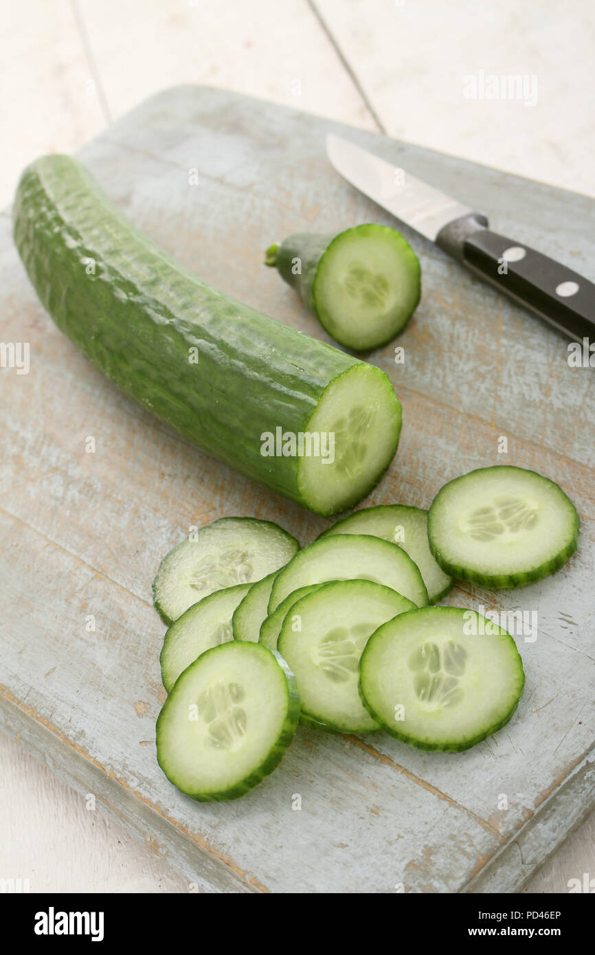 slicing fresh cucumber Stock Photo - Alamy