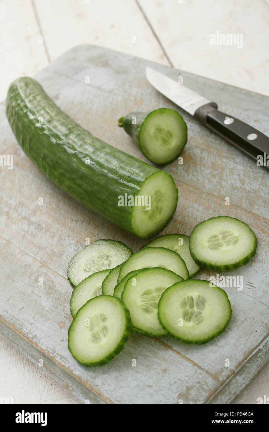 slicing fresh cucumber Stock Photo - Alamy