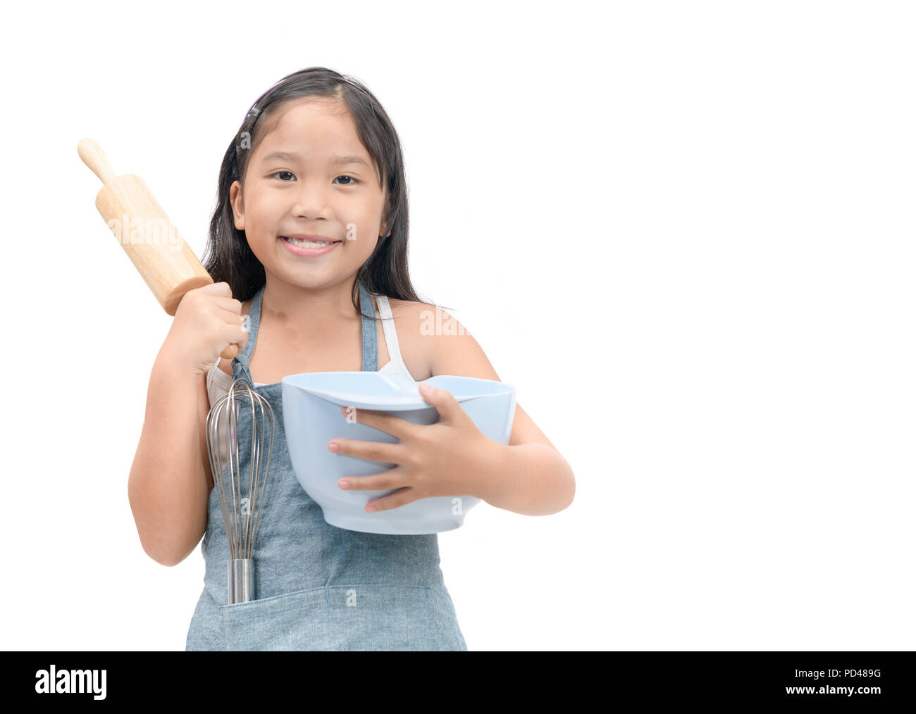 Cute asian girl holding cooking utensils isolated on white background ...