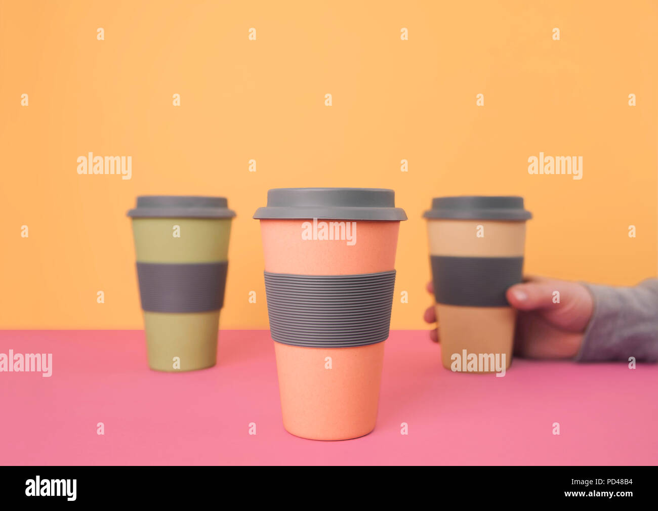 Hand holding take away coffee cup Stock Photo - Alamy