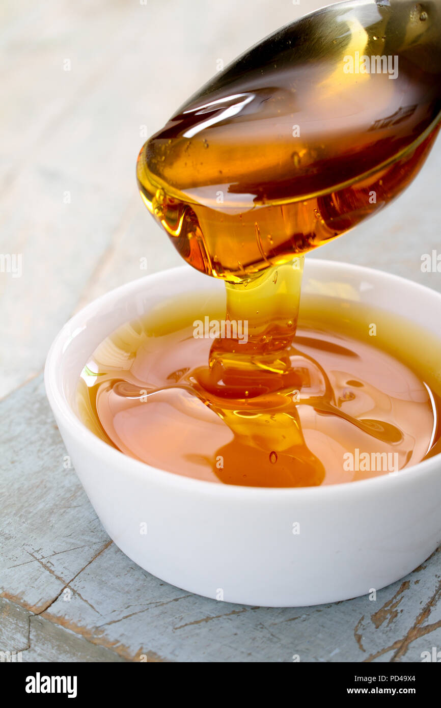refined golden sugar syrup in dish Stock Photo - Alamy