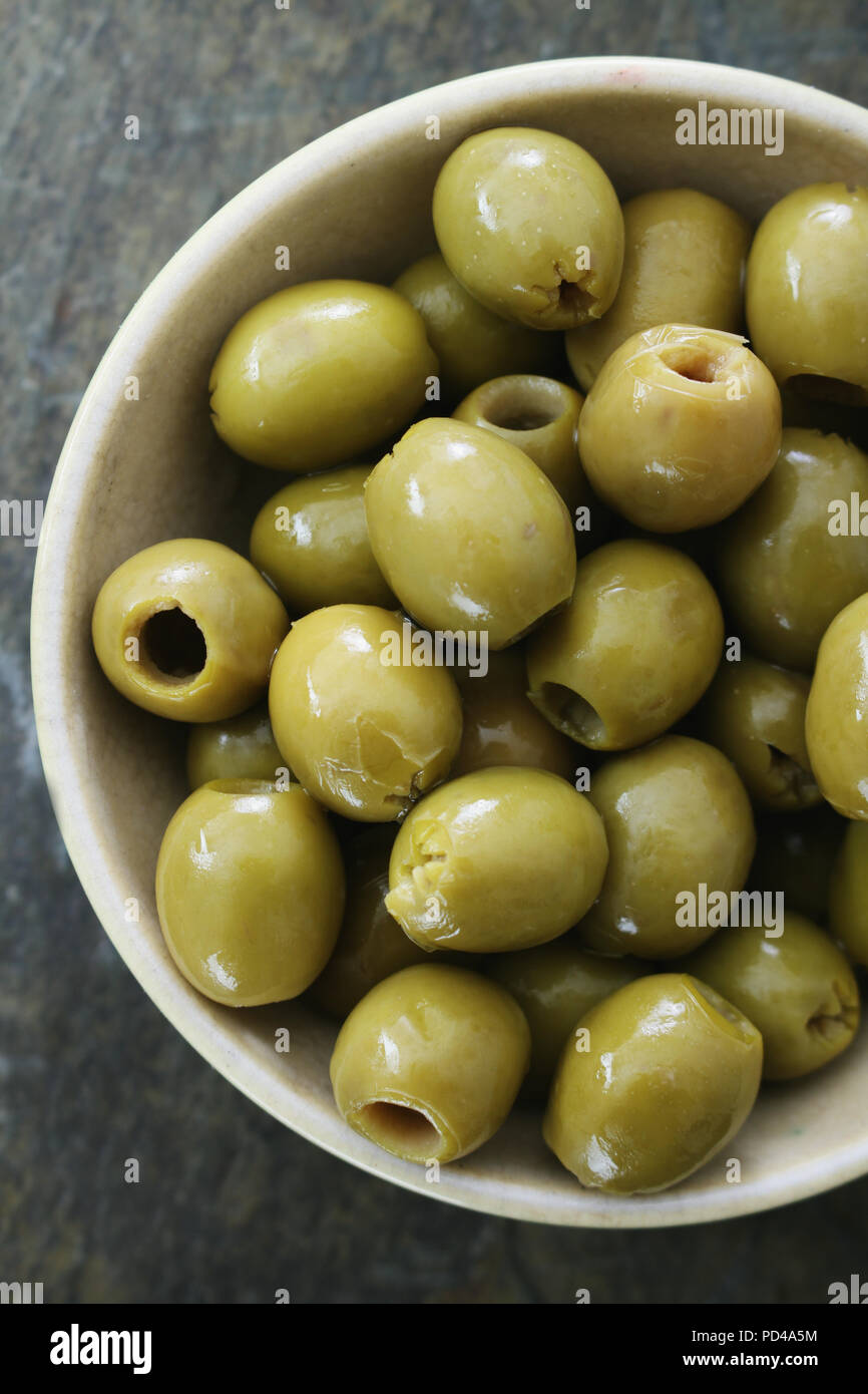 Pitted green olives in dish hi-res stock photography and images - Alamy