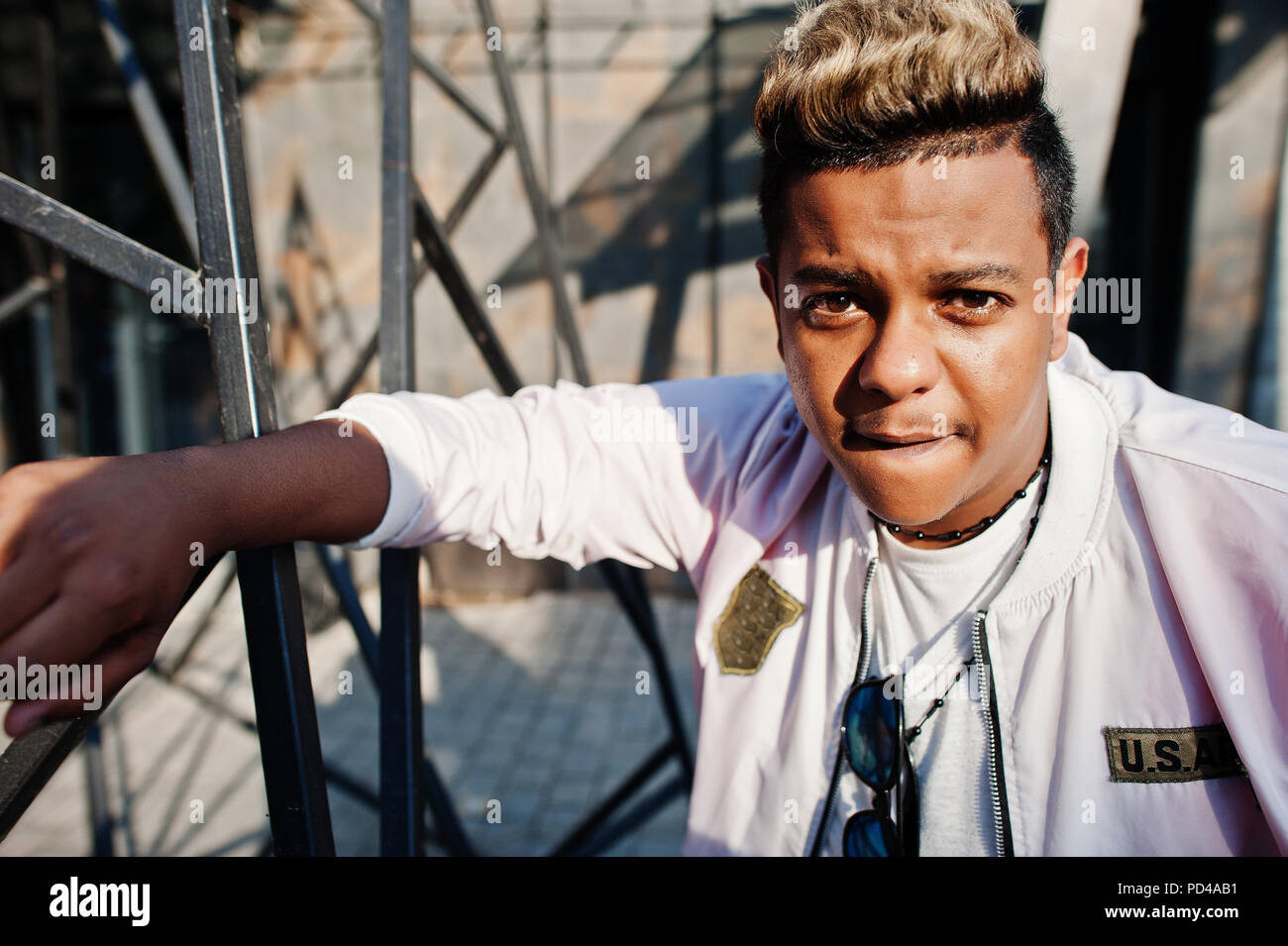 Stylish hipster arab man guy posed outdoor in street. Style rap singer ...