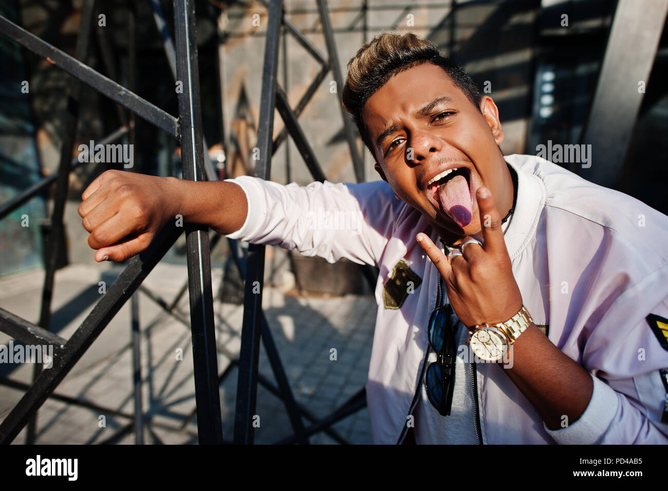 Stylish hipster arab man guy posed outdoor in street. Style rap singer ...