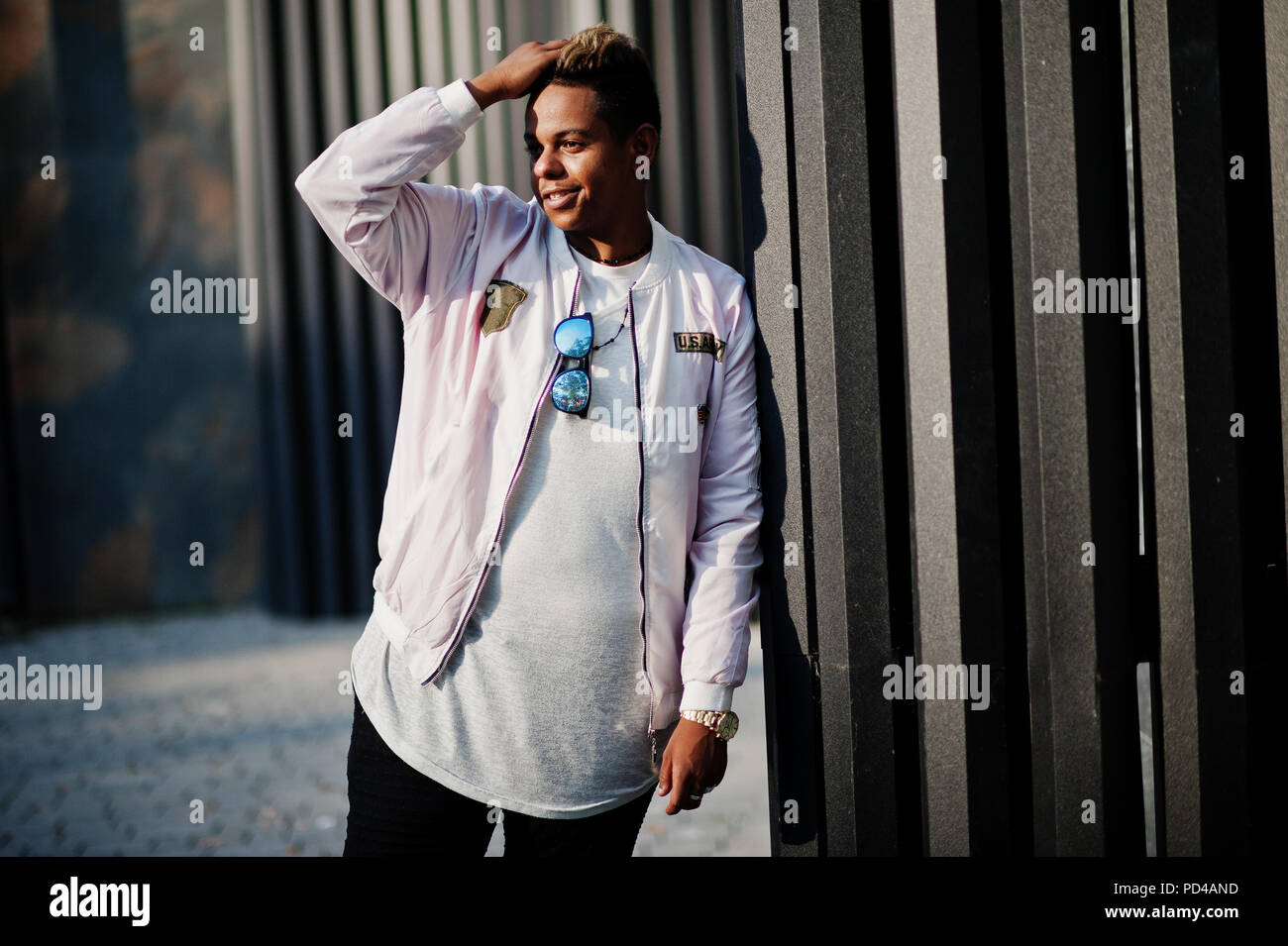 Stylish hipster arab man guy posed outdoor in street. Style rap singer ...