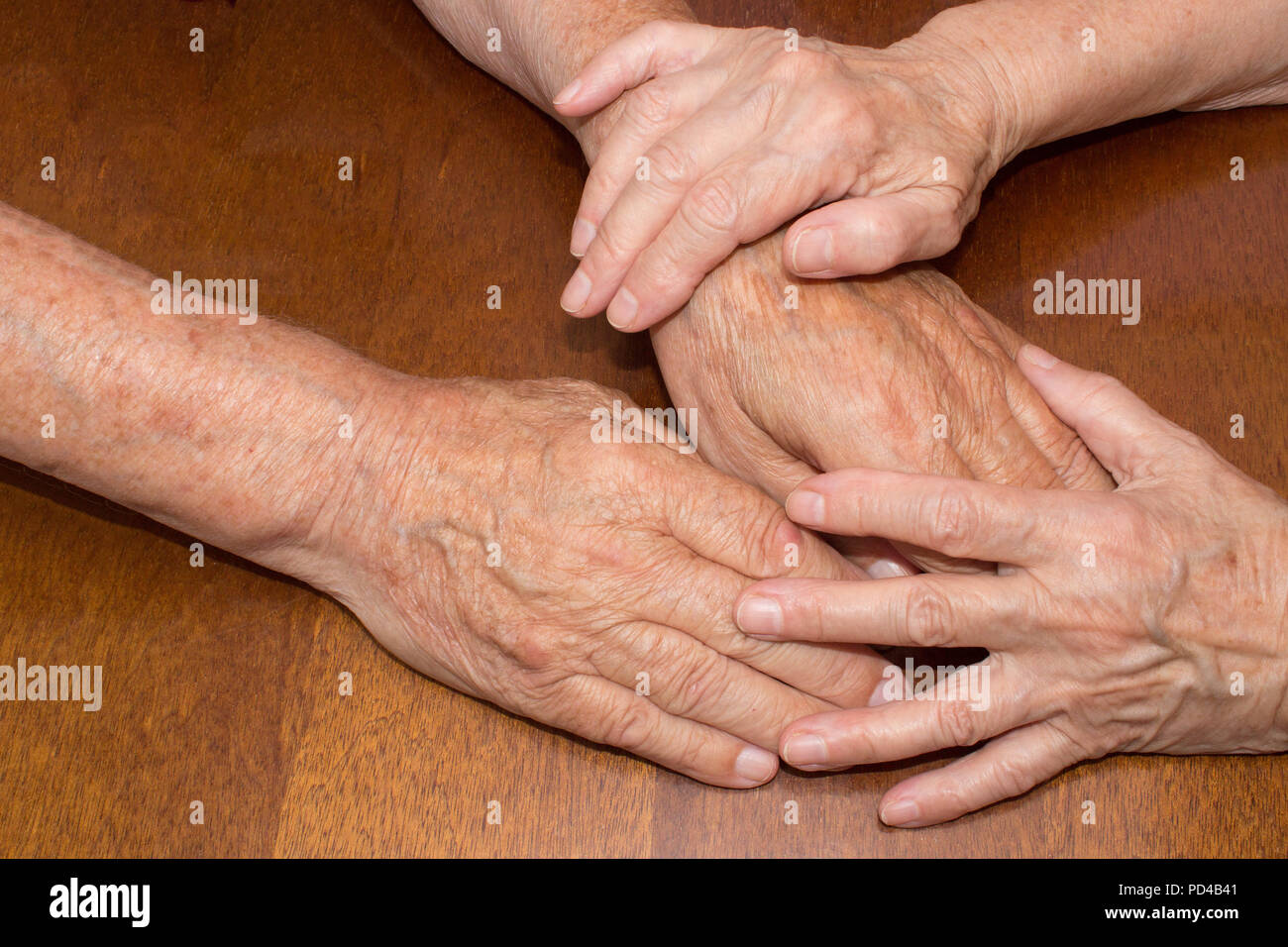 Old people holding hands. Closeup Stock Photo - Alamy