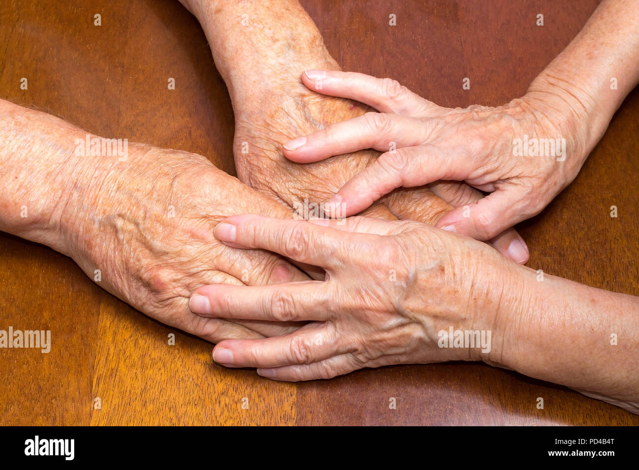 Old people holding hands. Closeup Stock Photo - Alamy