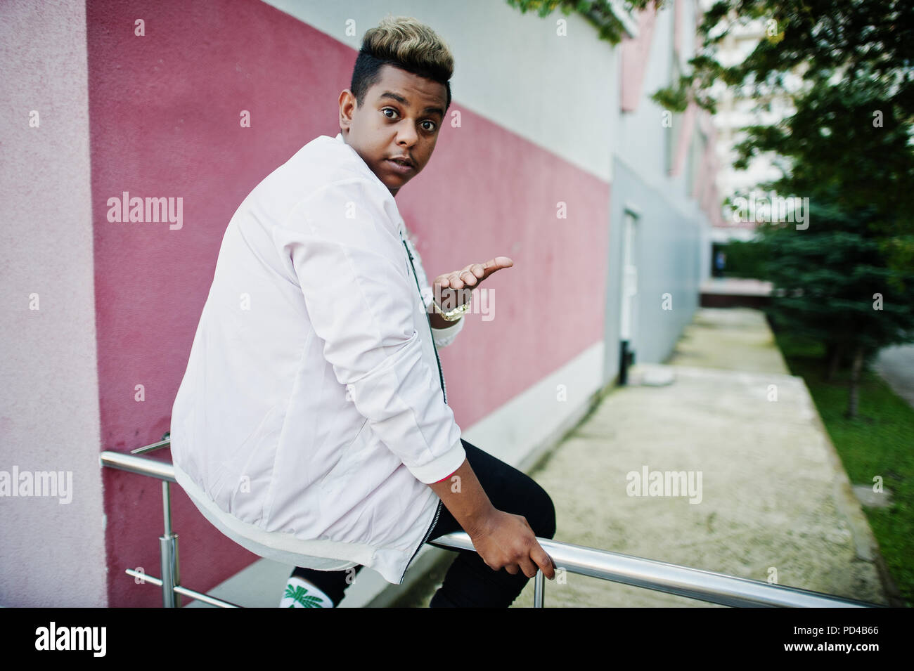 Stylish hipster arab man guy posed outdoor in street. Style rap singer ...