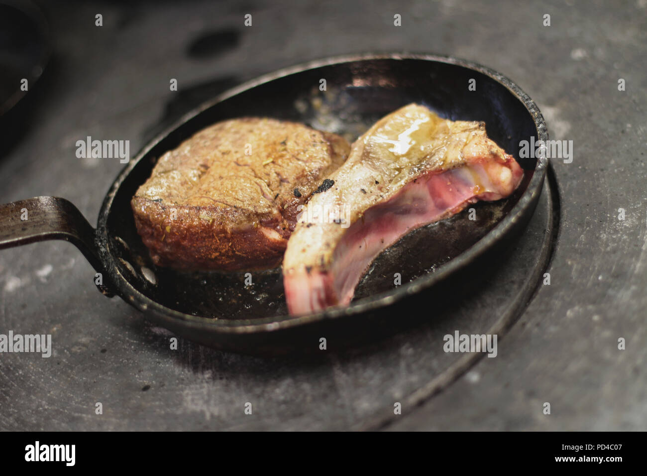 cooking meat on stove Stock Photo - Alamy
