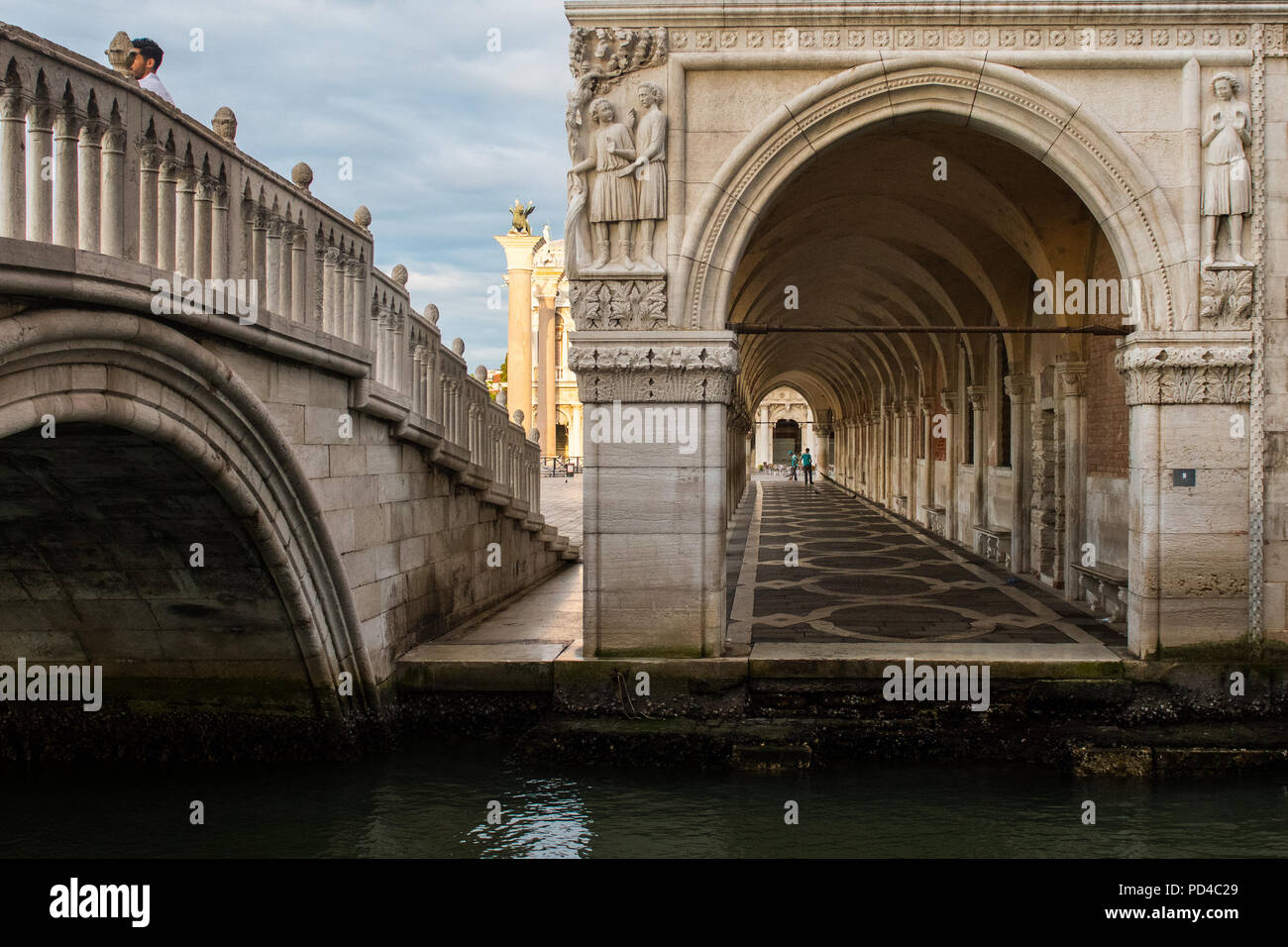 A view of the portico of Ducale Palace with the column of the lion of ...