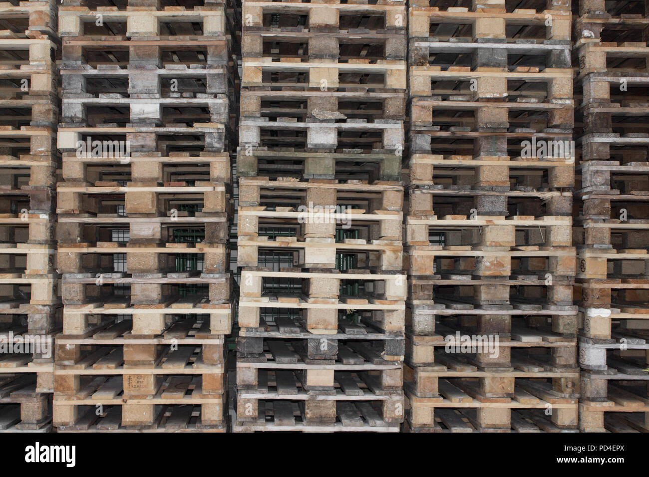 Big frame filling stack of lots of wooden pallets for transport or ...