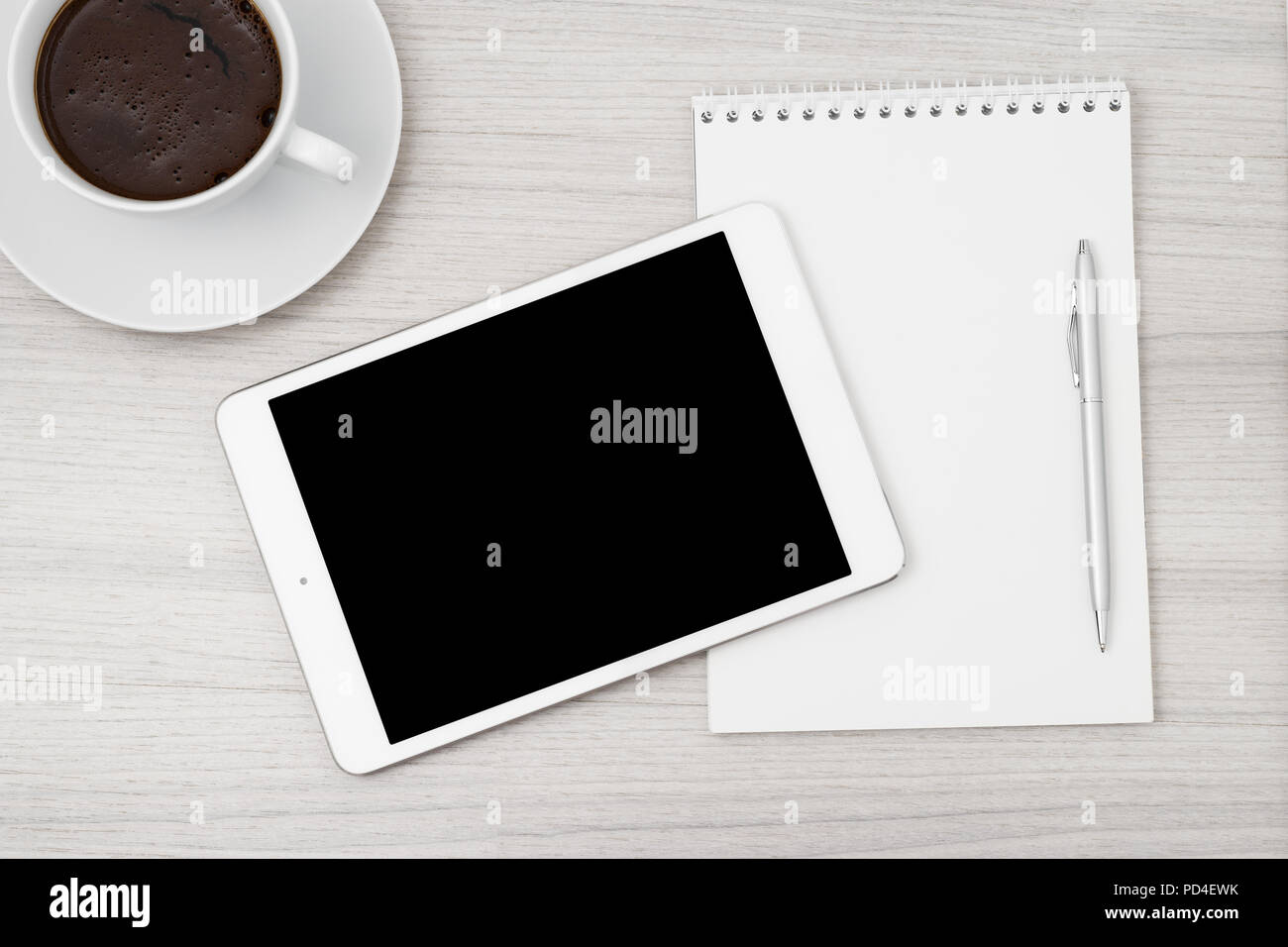 Tablet computer on the white table Stock Photo - Alamy