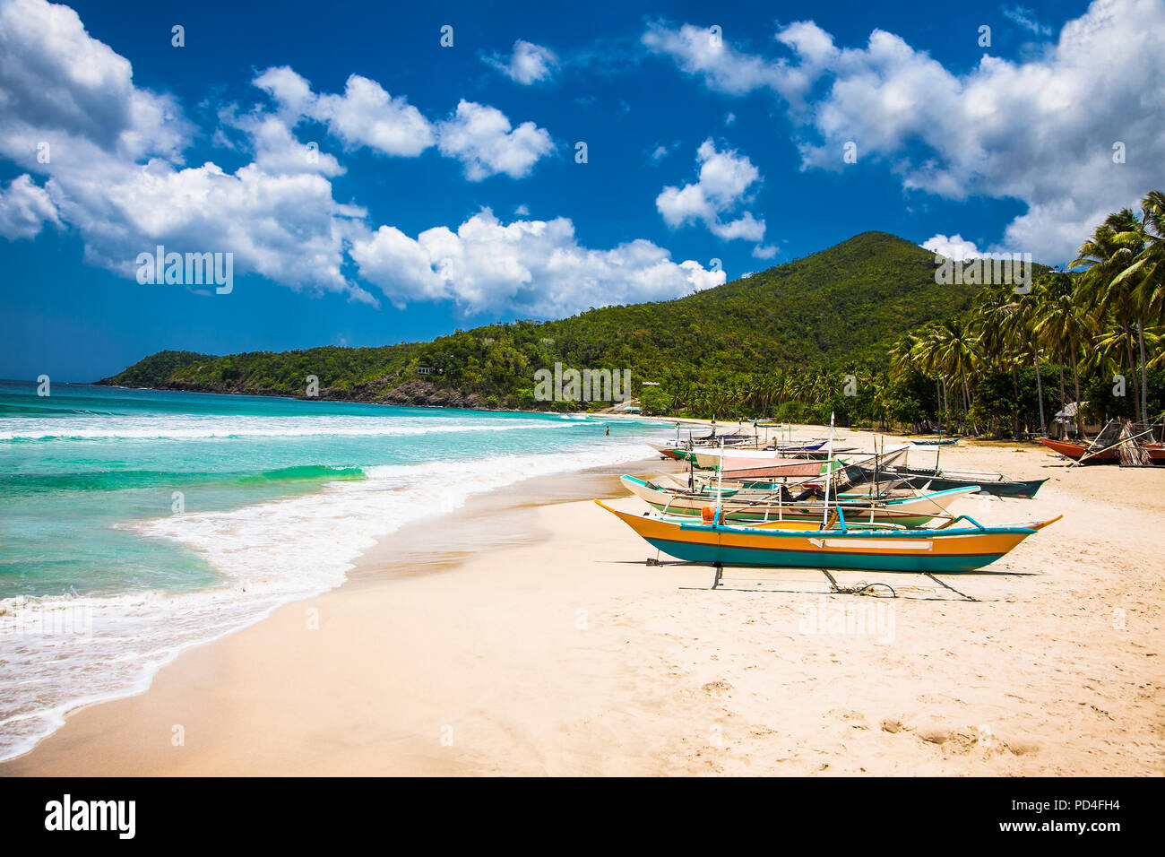 Traditional boats on Sabang beach, Puerto Princesa, Palawan island ...