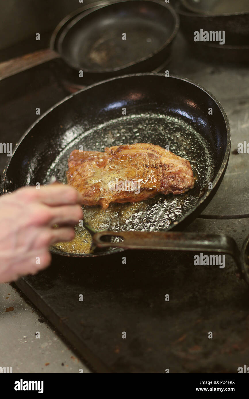 cooking meat on stove Stock Photo - Alamy