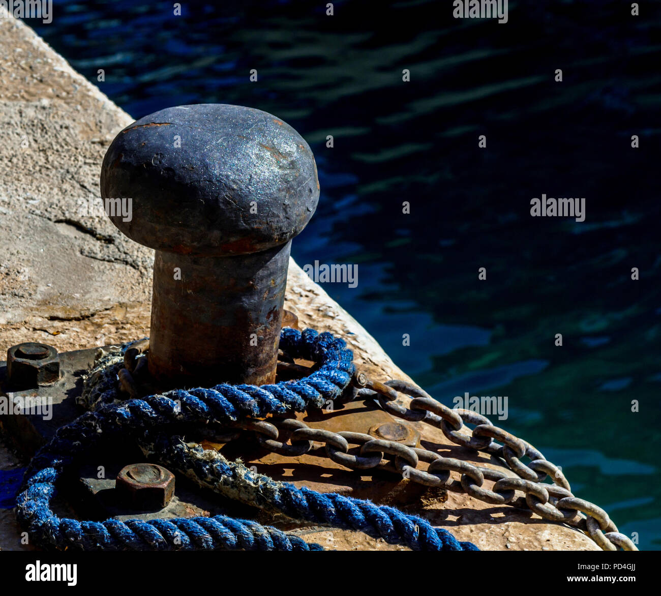 mooring post on the waterfront in a small marina, element for mooring ...