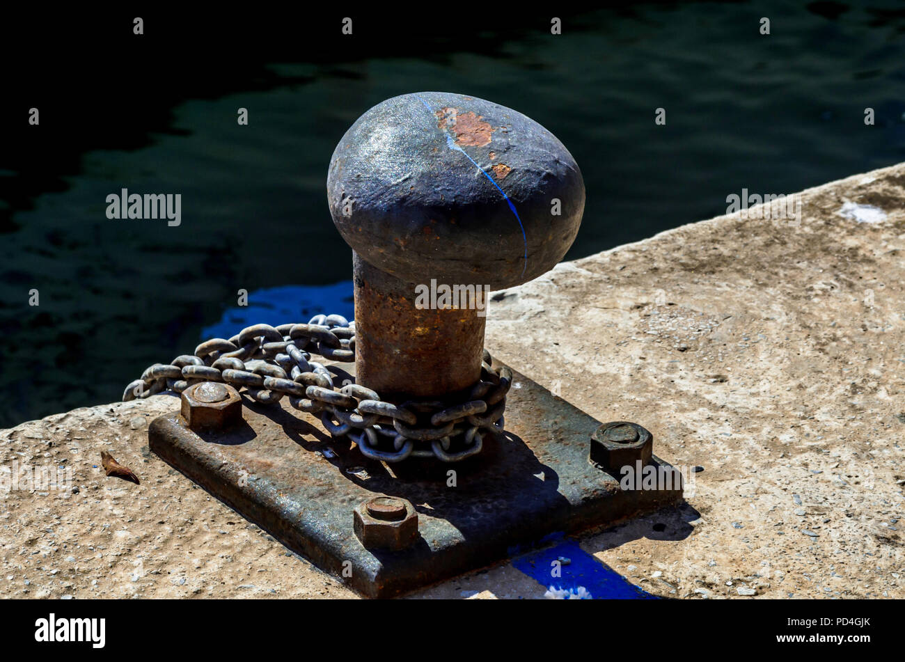 mooring post on the waterfront in a small marina, element for mooring ...
