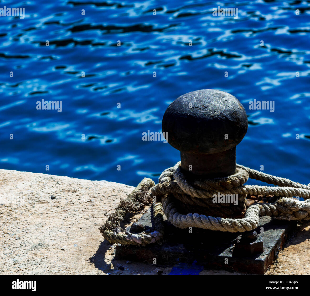 mooring post on the waterfront in a small marina, element for mooring ...