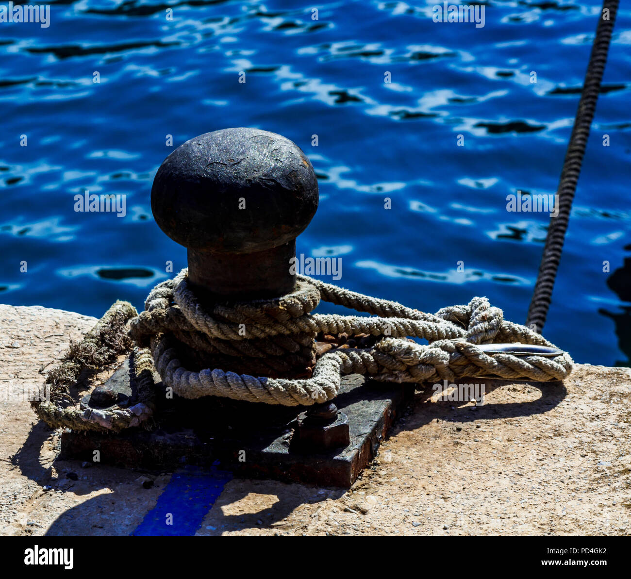 mooring post on the waterfront in a small marina, element for mooring ...