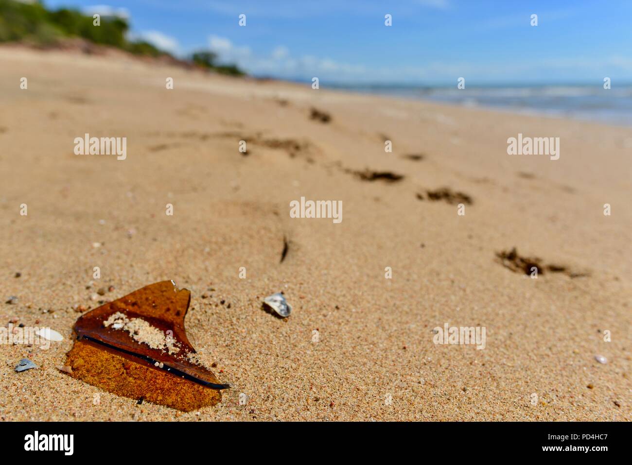Footprints in the sand near broken glass hi-res stock photography and ...